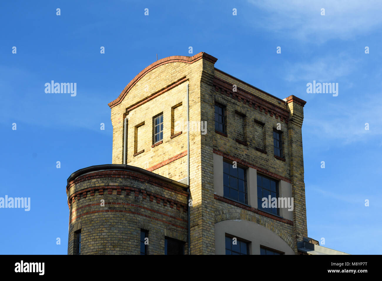 small brick house against blue sky Stock Photo - Alamy