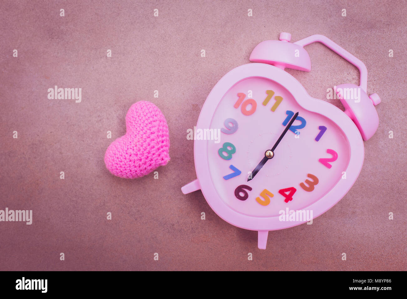 Love times: heart shape clock with pink heart top view valentine day ...