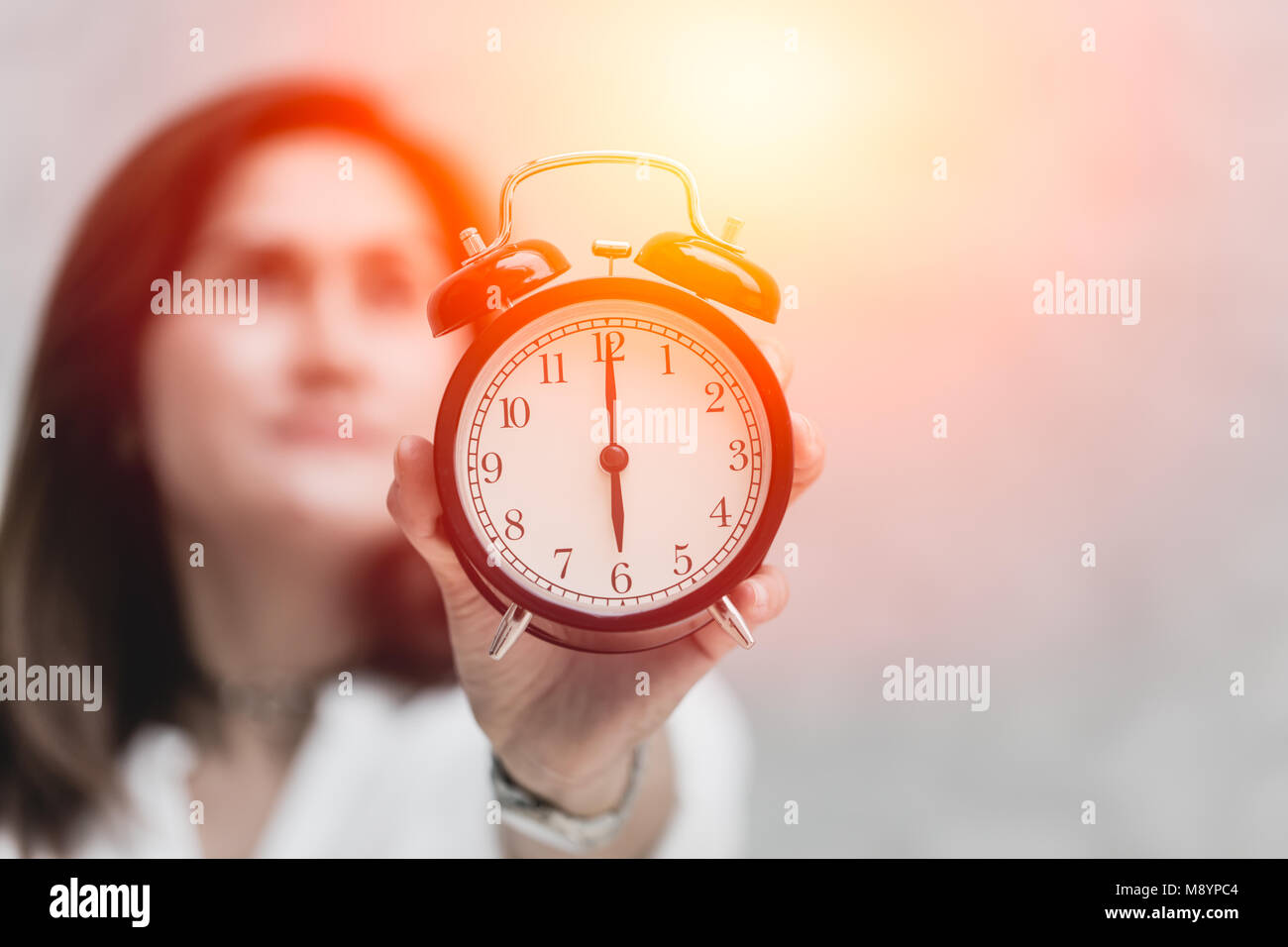 Women show clock with proudly expression face background Stock Photo ...