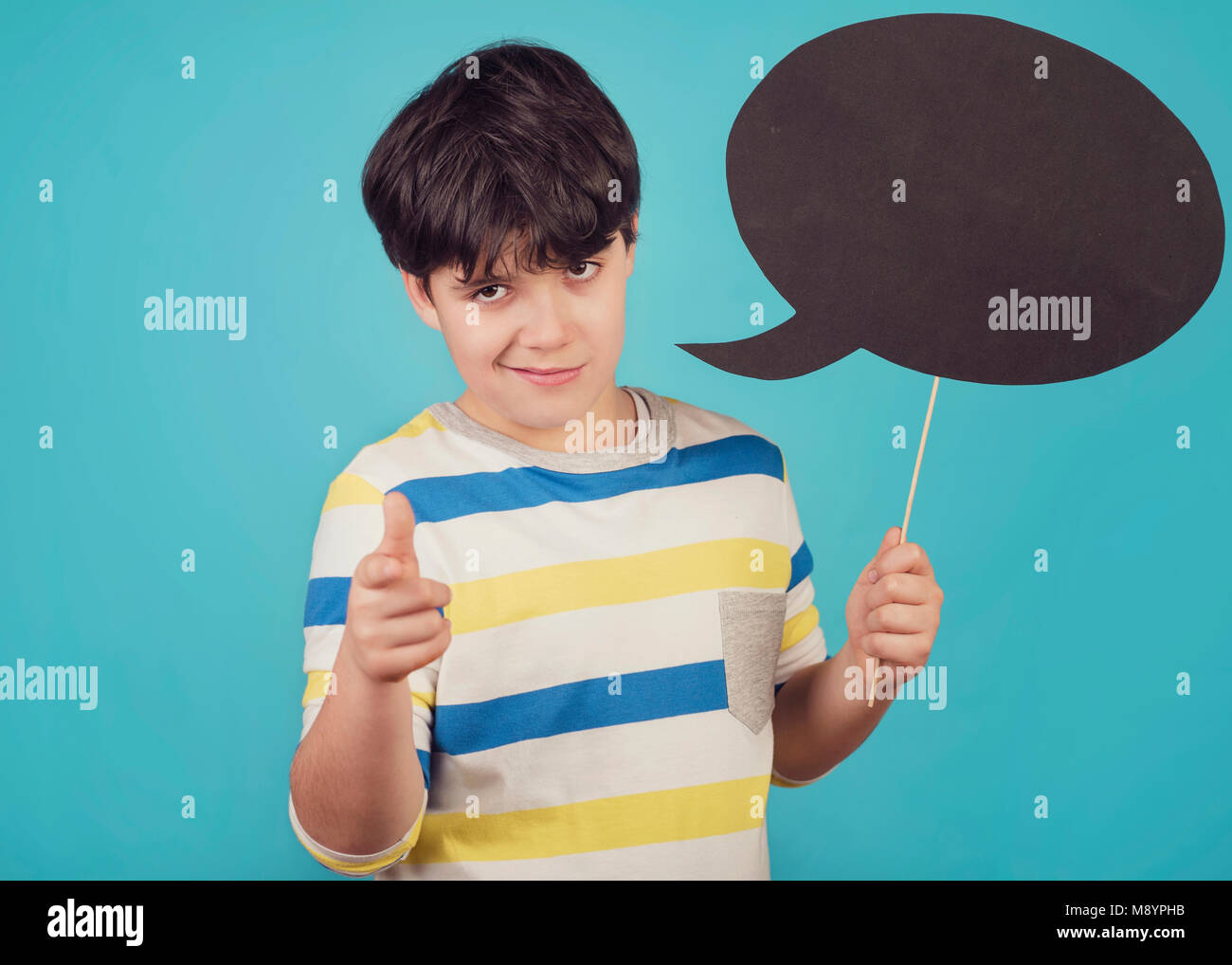 Boy holding a sign on blue background Boy holding a sign on blue ...