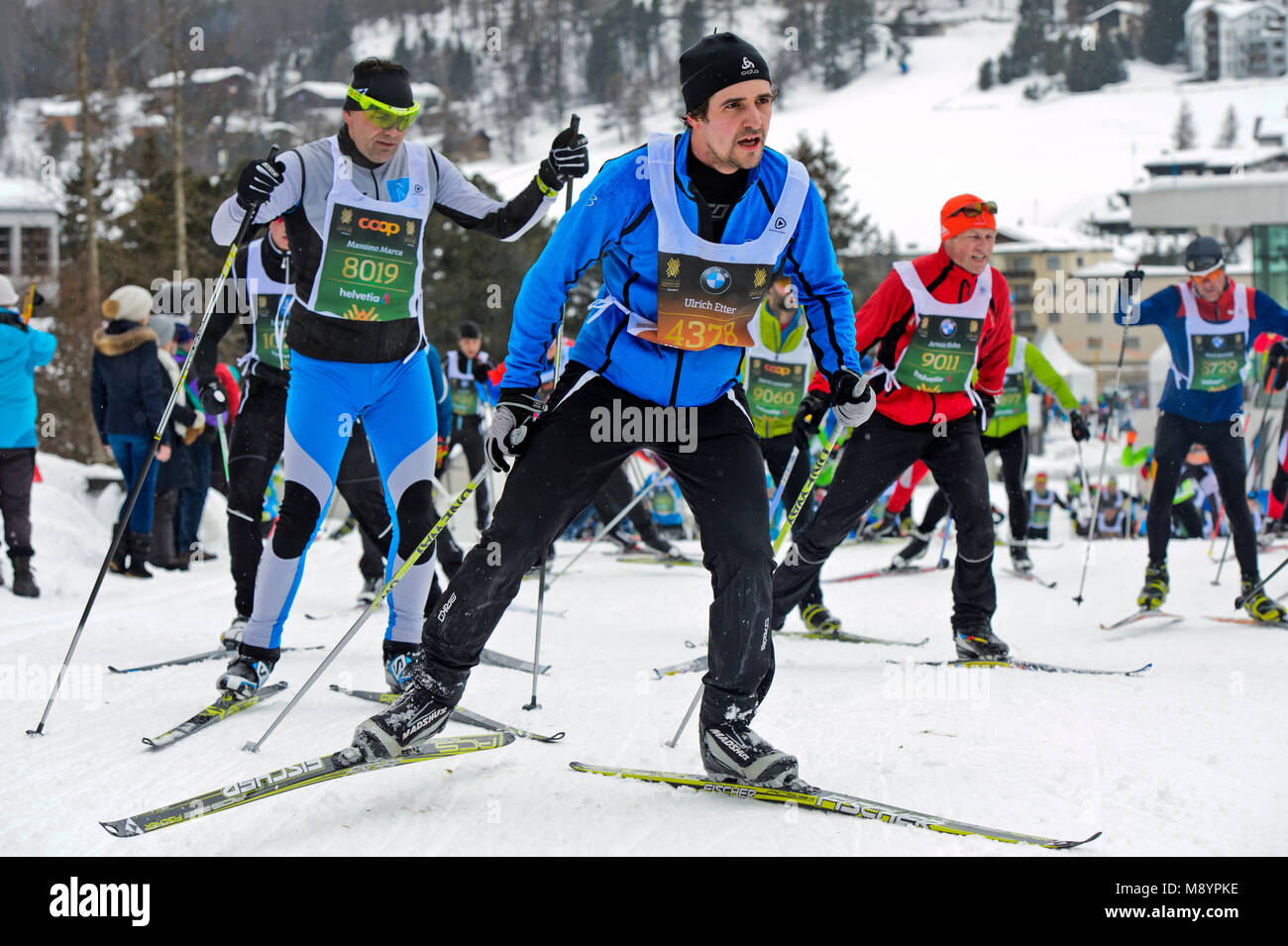 Cross country skiers at the Engadin Skimarathon on the climb to the ...