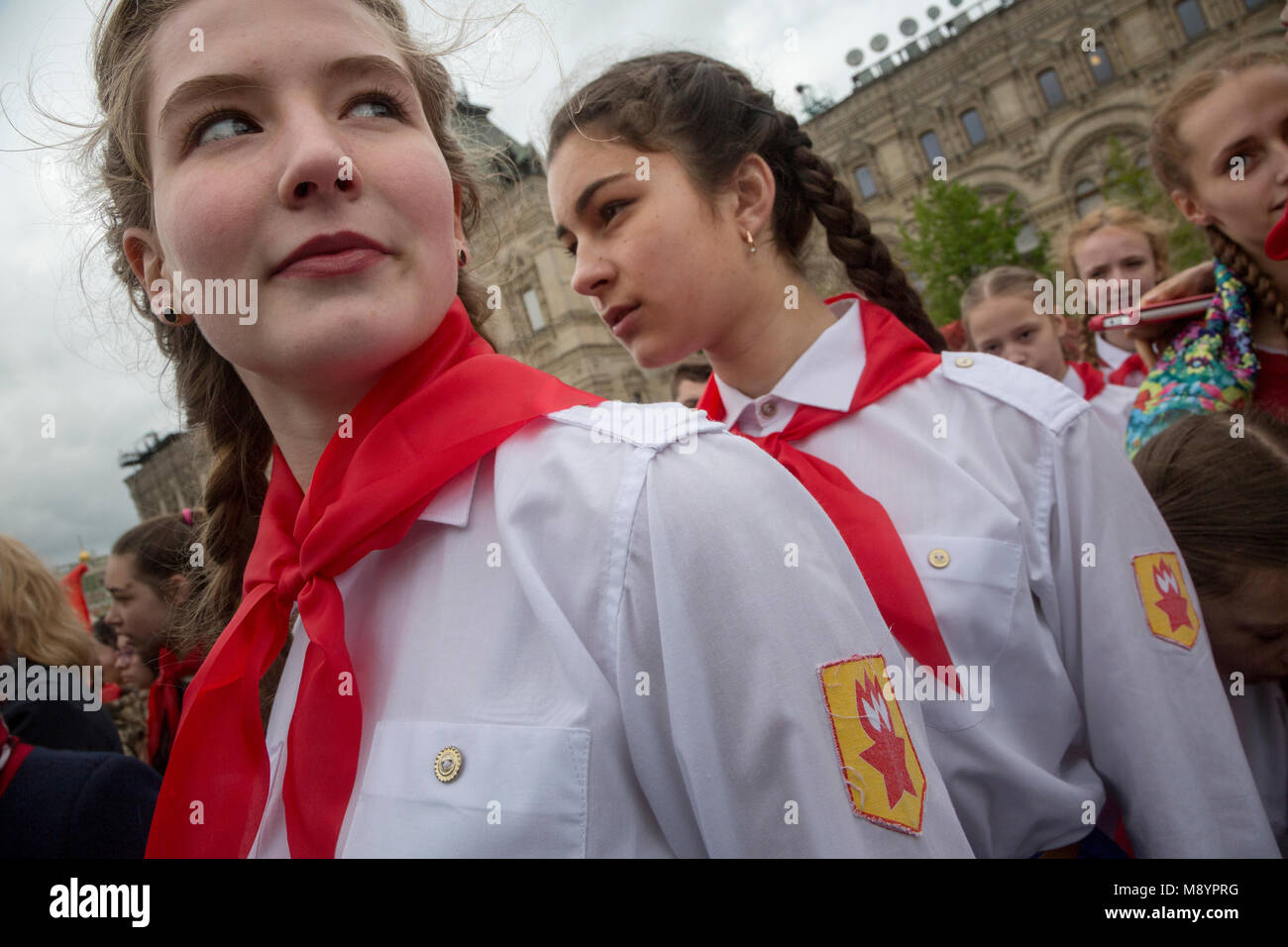 Schoolchildren attend a ceremony to admit children into the Pioneer ...