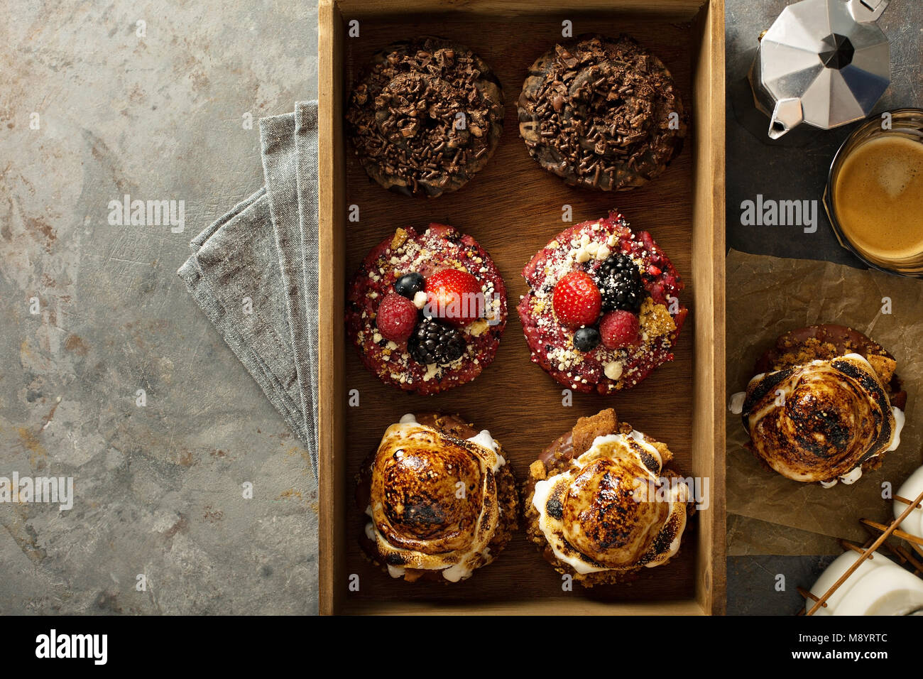 Variety of donuts in a wooden box Stock Photo - Alamy