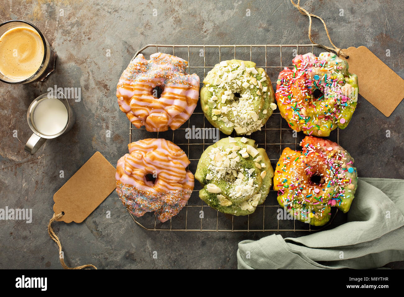Variety of donuts on a cooling rack Stock Photo - Alamy