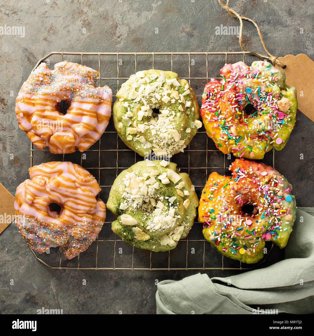 Variety of donuts on a cooling rack Stock Photo - Alamy