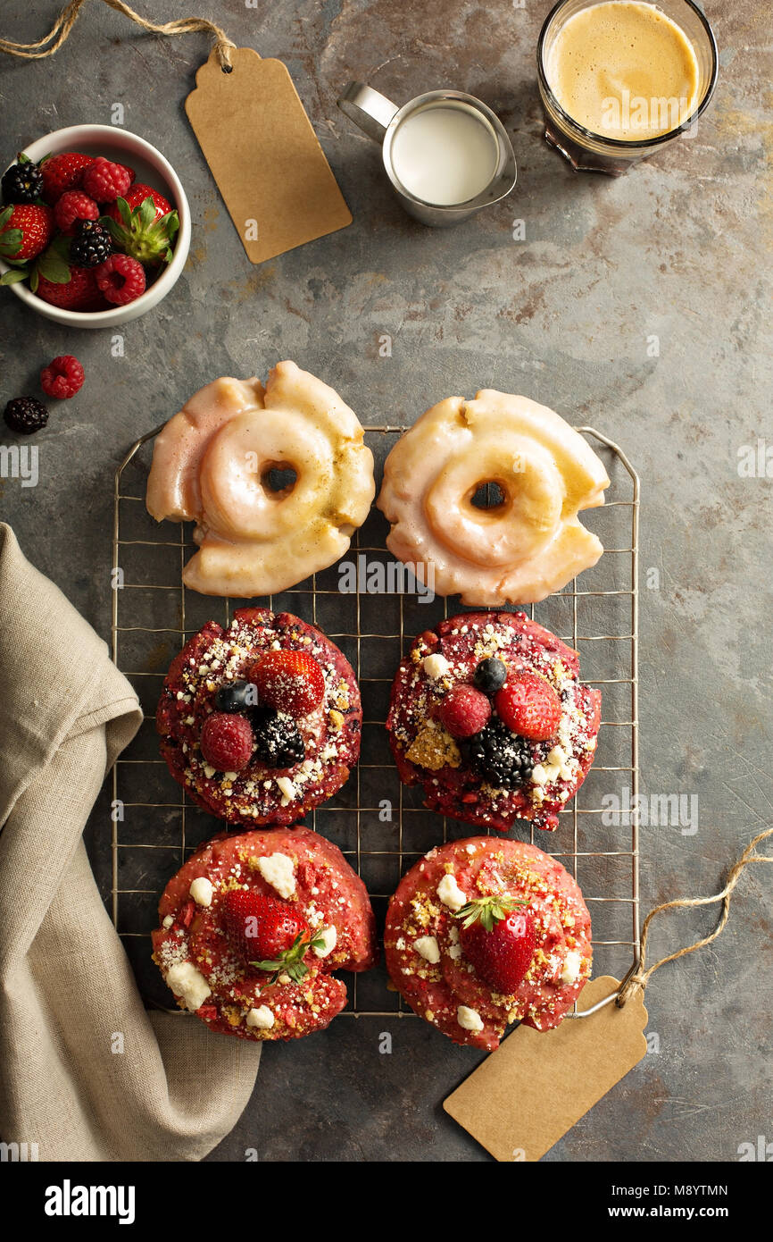 Variety of donuts on a cooling rack Stock Photo - Alamy