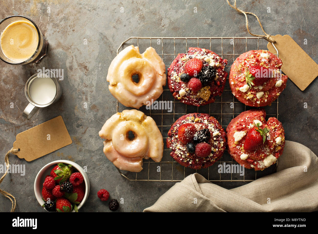 Variety of donuts on a cooling rack Stock Photo - Alamy