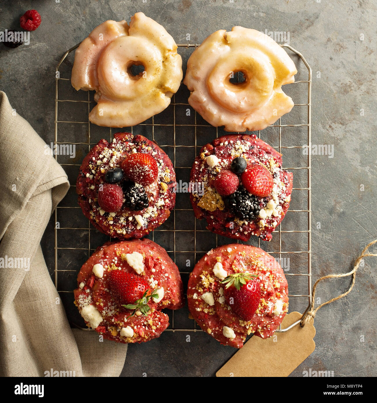Variety of donuts on a cooling rack Stock Photo - Alamy