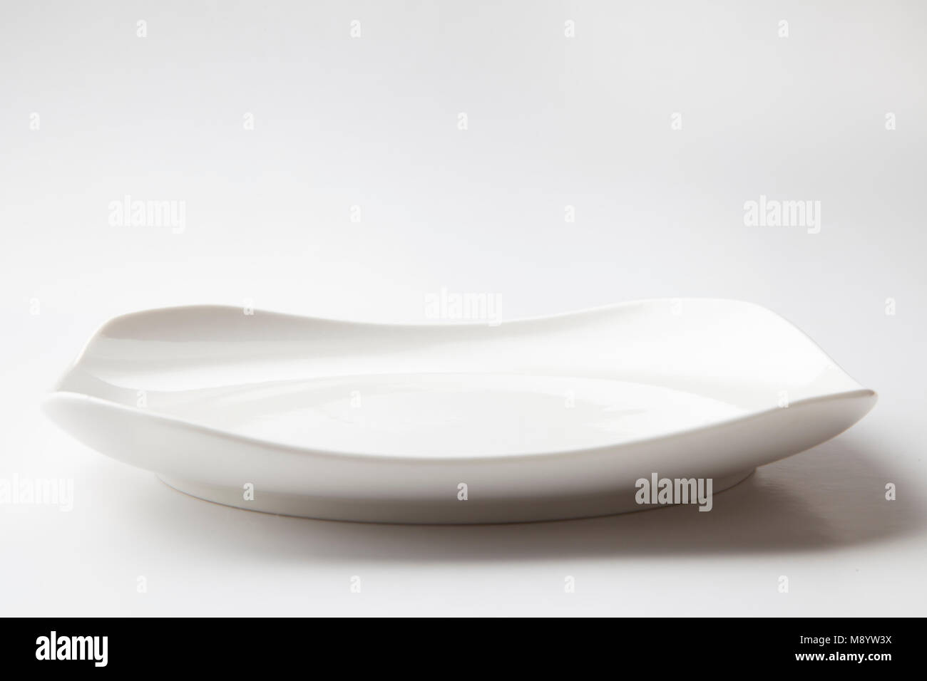 White square plate Stock Photo - Alamy