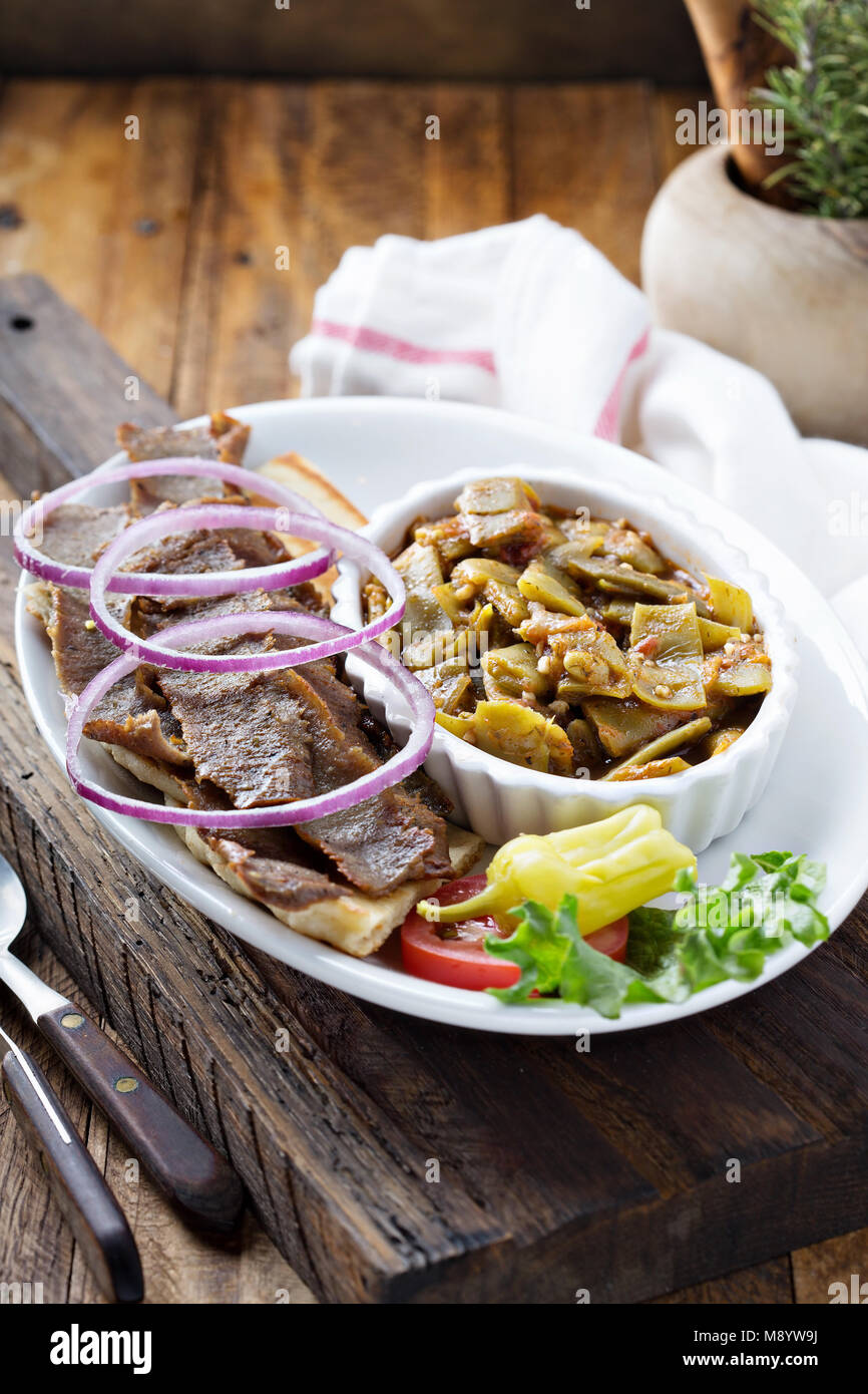 Gyro plate with meat on a pita Stock Photo - Alamy