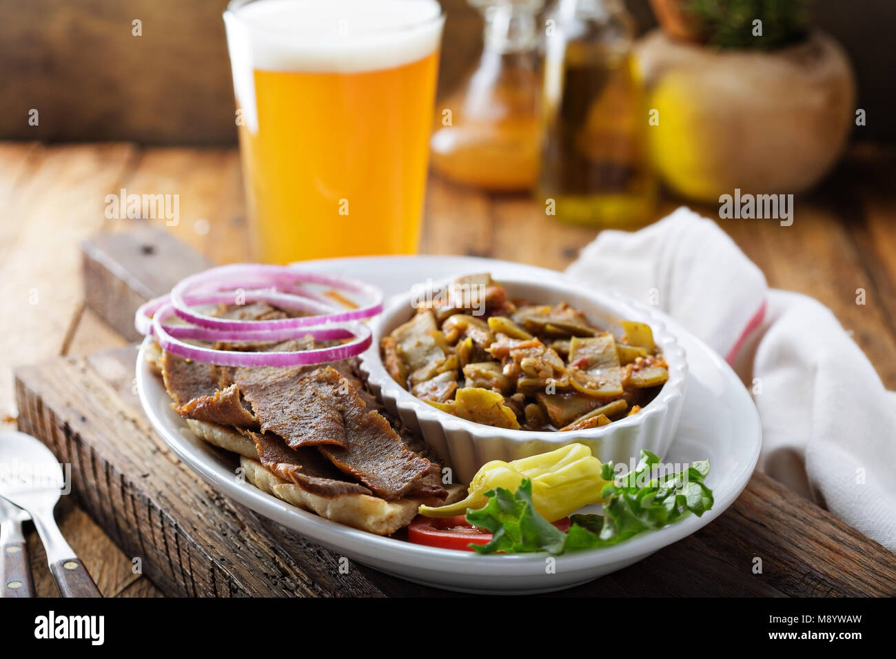 Gyro plate with meat on a pita Stock Photo - Alamy