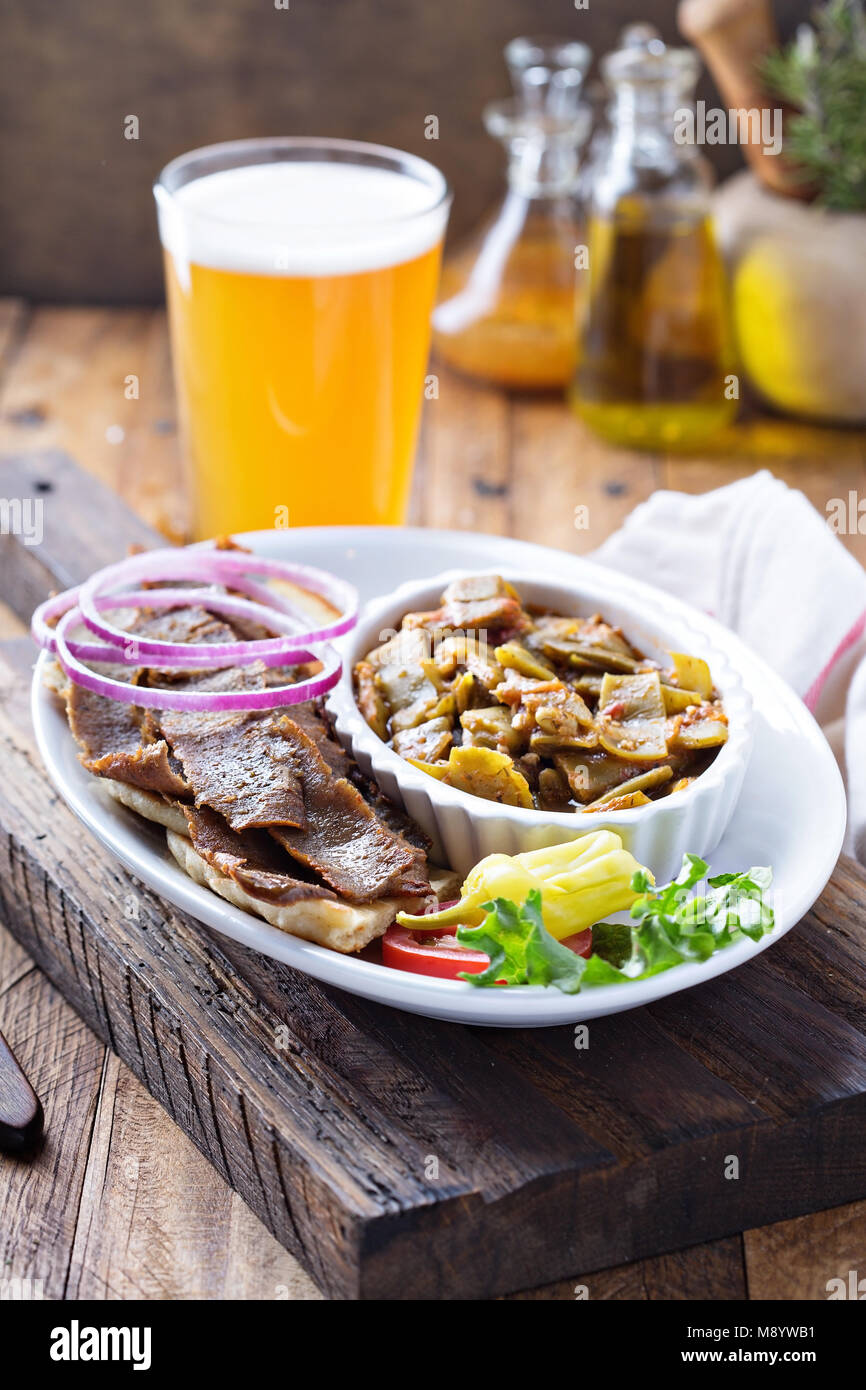 Gyro plate with meat on a pita Stock Photo - Alamy