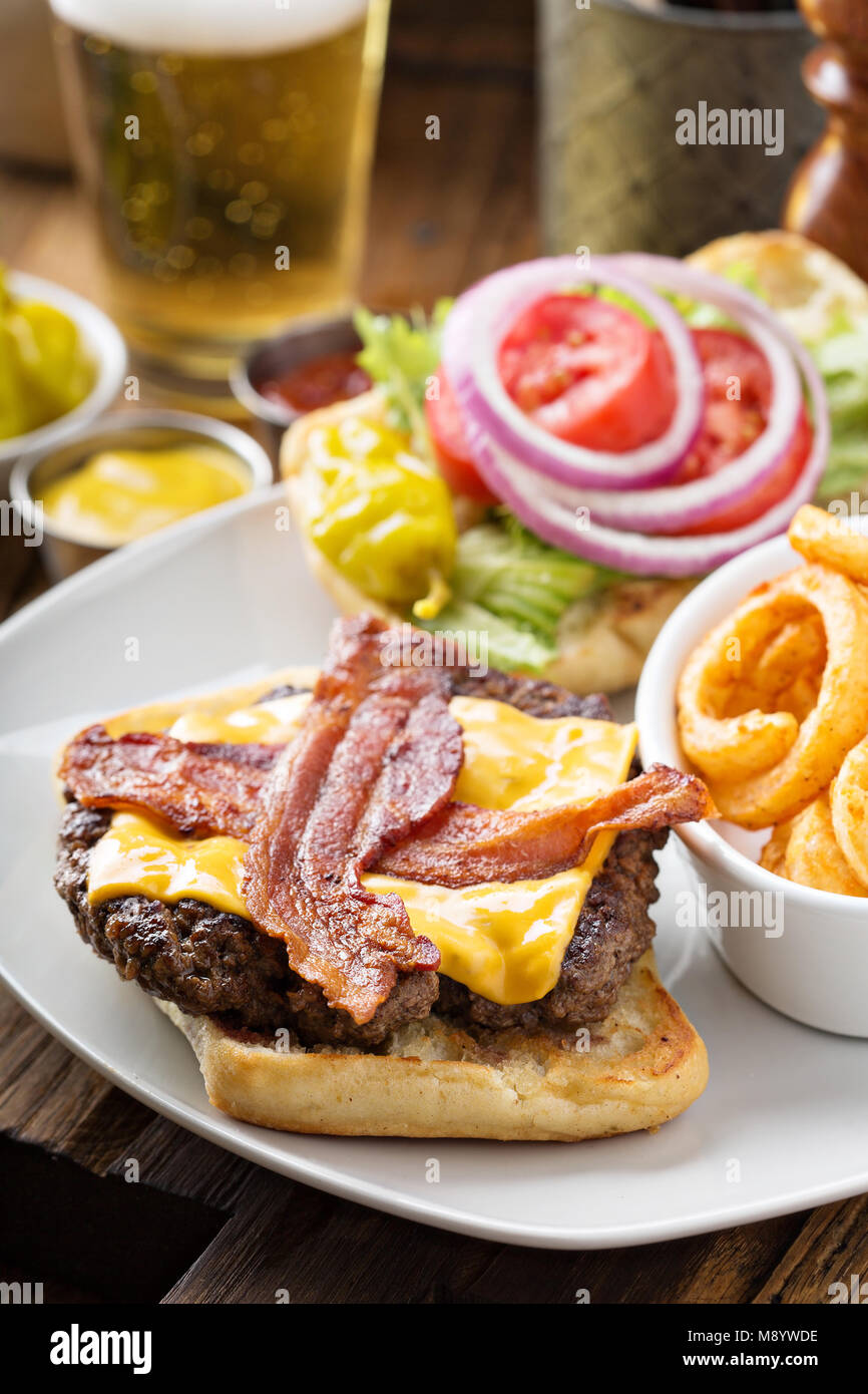 Traditional american burger with cheese and bacon Stock Photo - Alamy