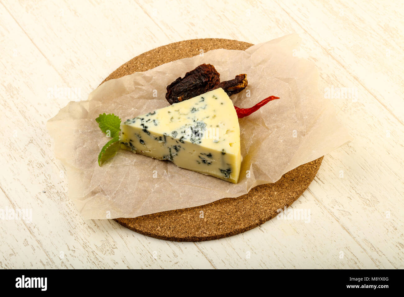 Blue cheese with mint over the wooden background Stock Photo - Alamy