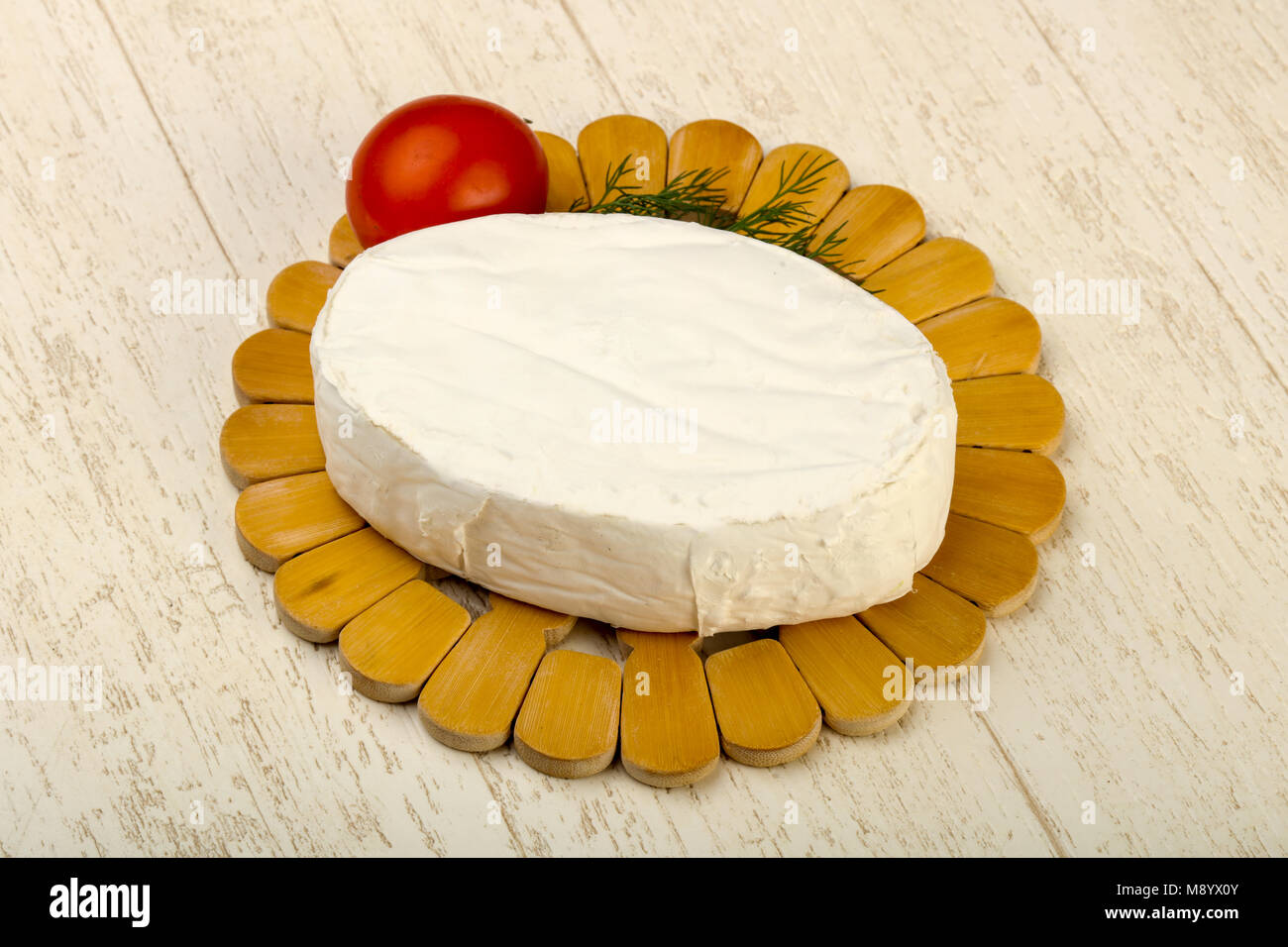 Camembert cheese over the wooden background Stock Photo - Alamy