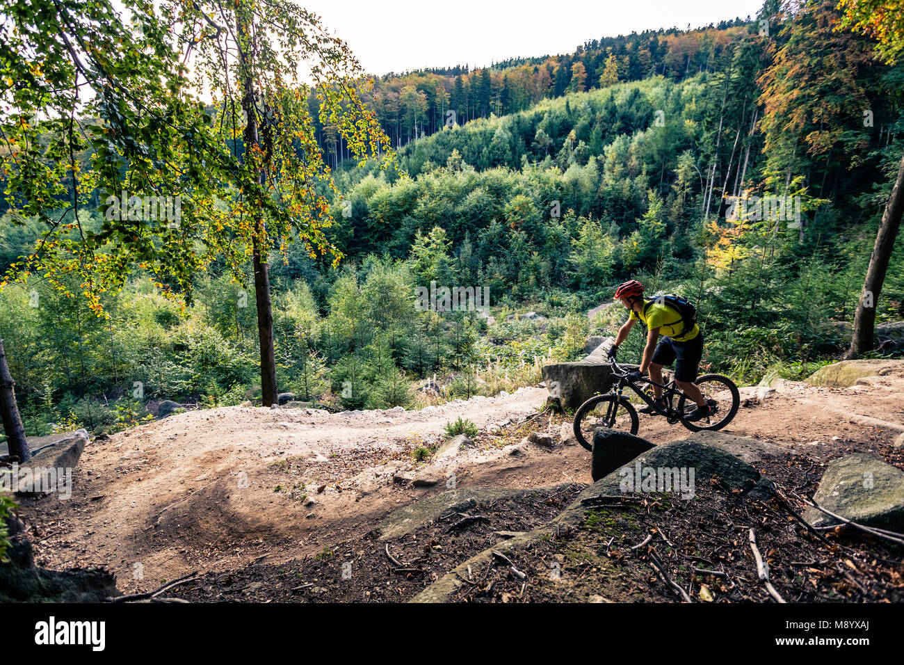 Mountain biker riding on bike in autumn inspirational mountains ...