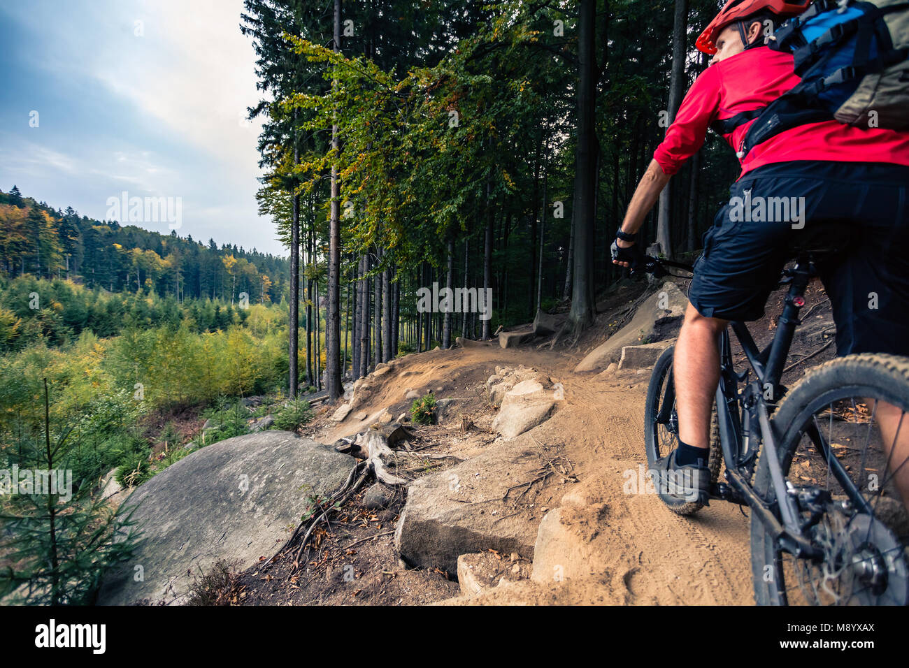 Mountain biker riding on bike in autumn inspirational mountains ...