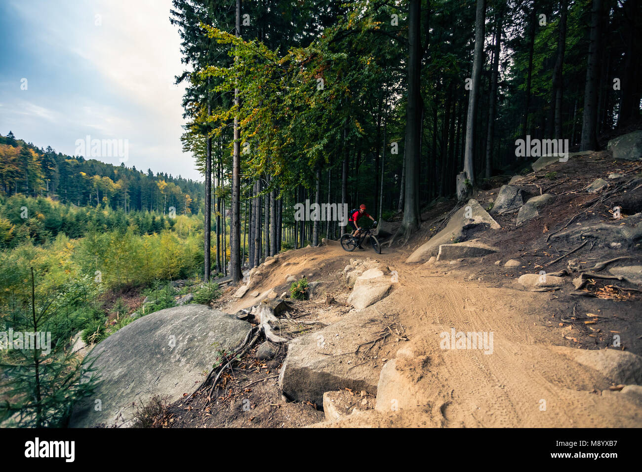 Mountain biker riding on bike in autumn inspirational mountains ...