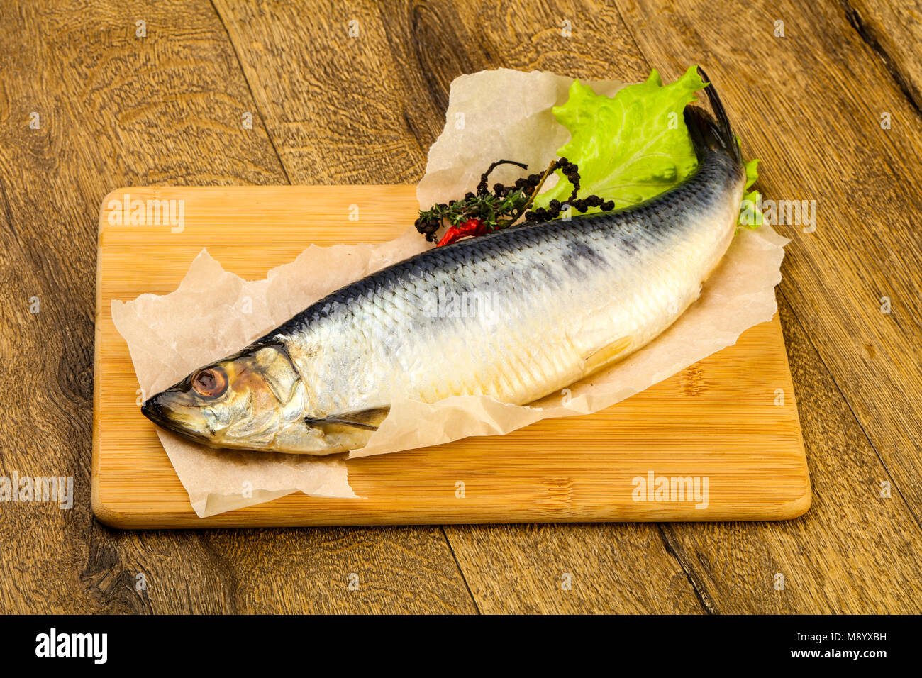 Salted Herring fish with pepper and spices Stock Photo - Alamy