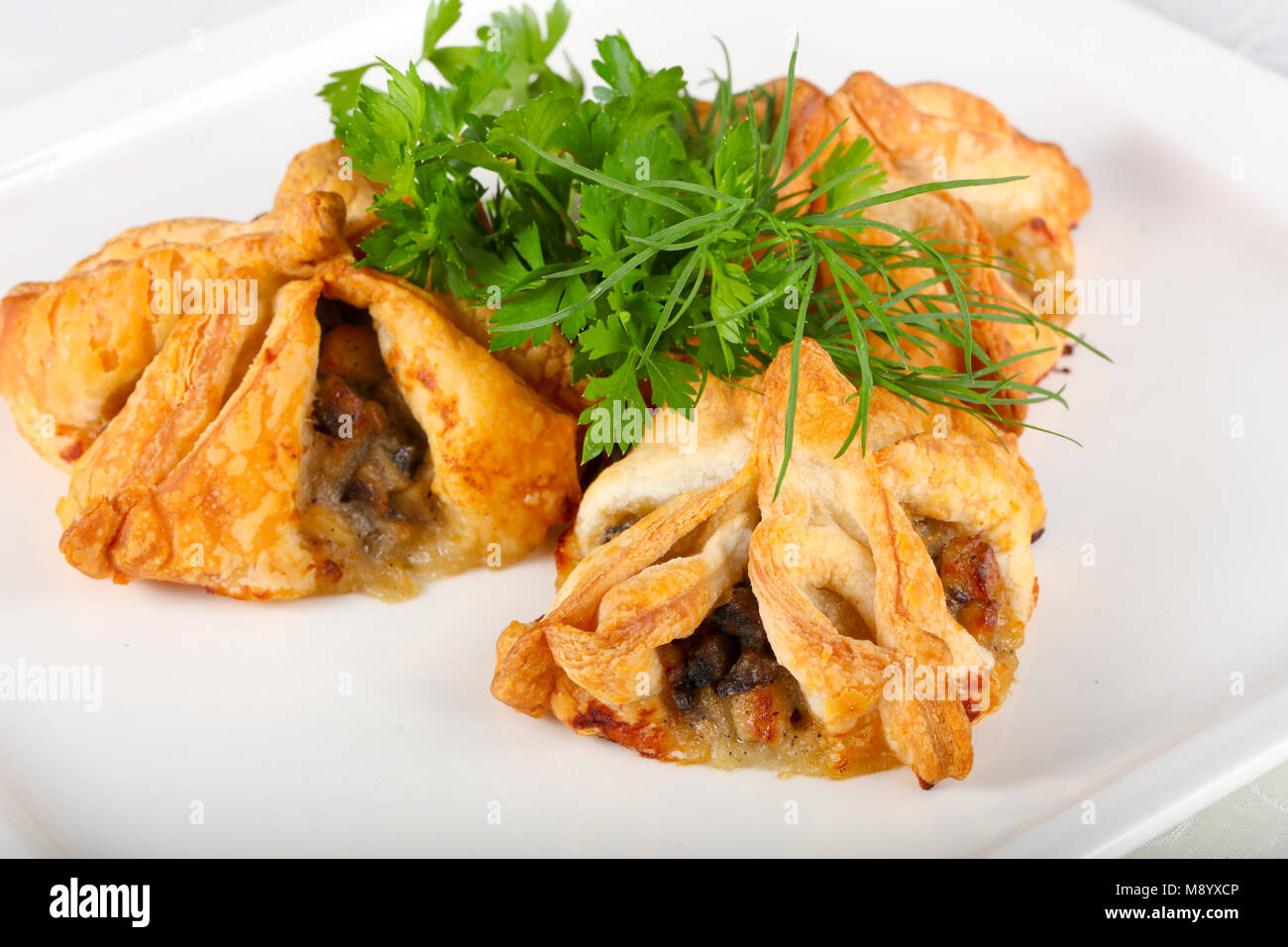 Pastry with meat served parsley Stock Photo - Alamy