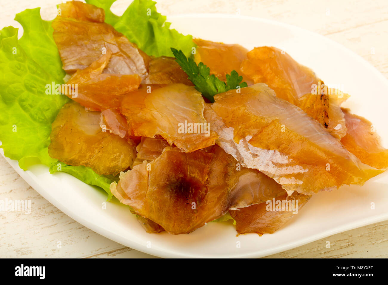 Smoked catfish fillet carpaccio Stock Photo - Alamy