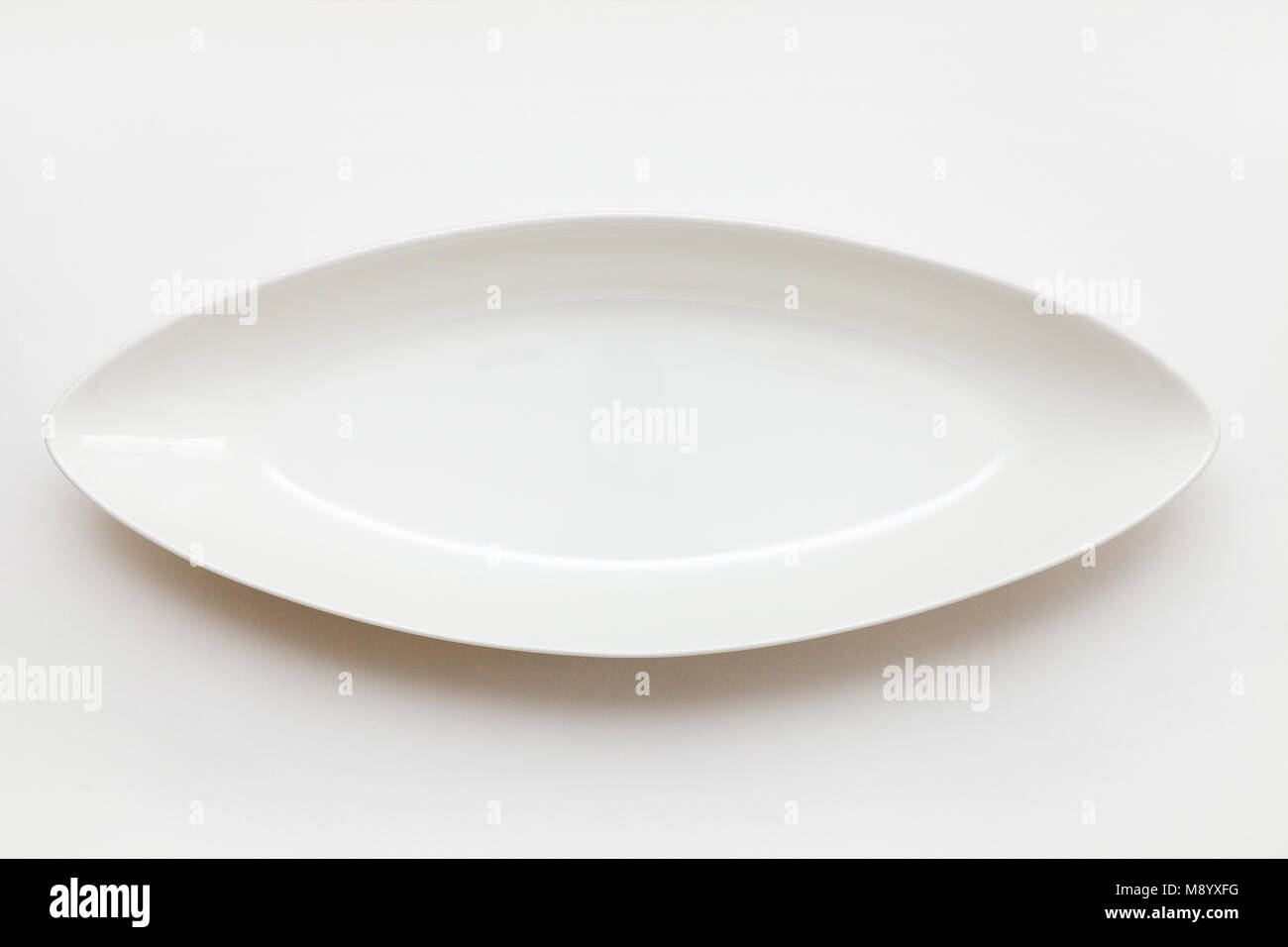 Empty white oval dish Stock Photo - Alamy