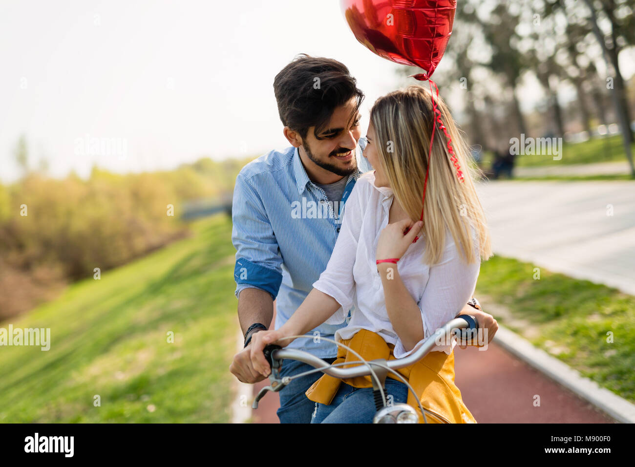 Romantic couple with bicycle hi-res stock photography and images - Alamy