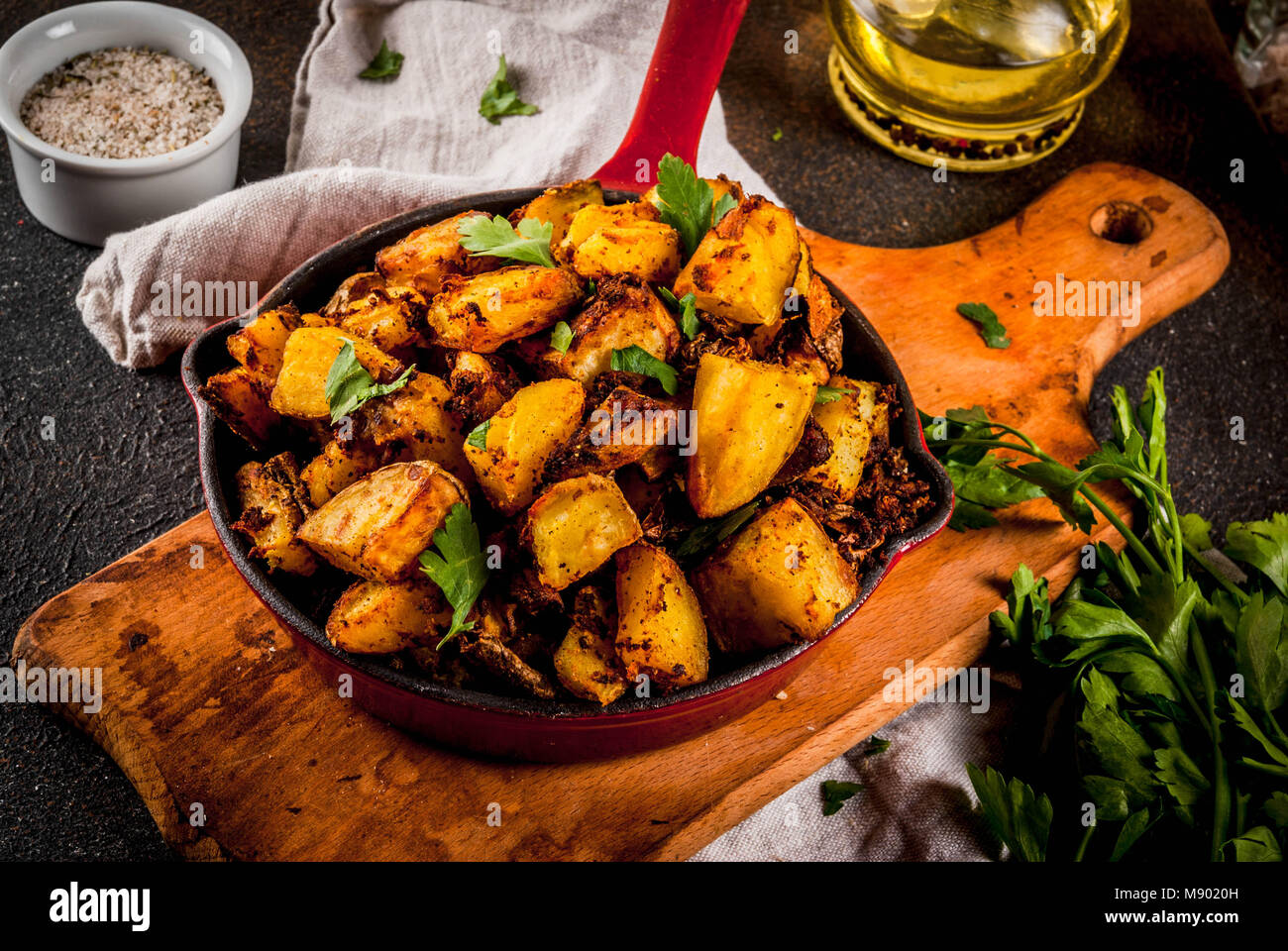 Indian food, Bombay Potatoes on dark rusty background copy space Stock ...