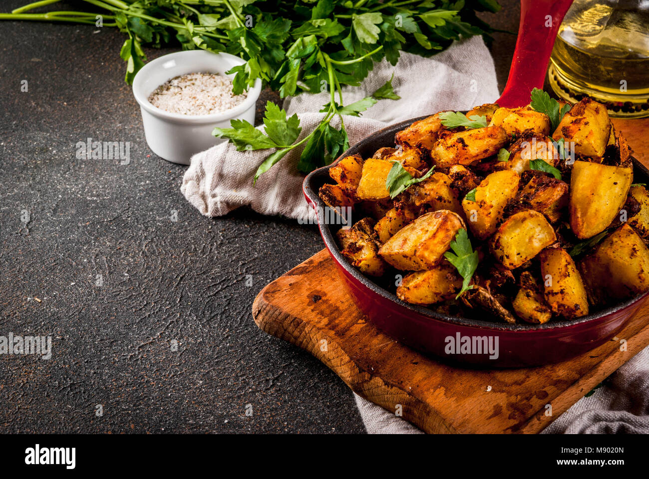 Indian food, Bombay Potatoes on dark rusty background copy space Stock ...
