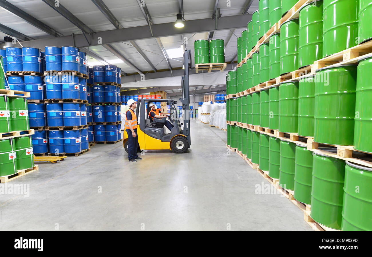 group of workers in the logistics industry work in a warehouse with ...