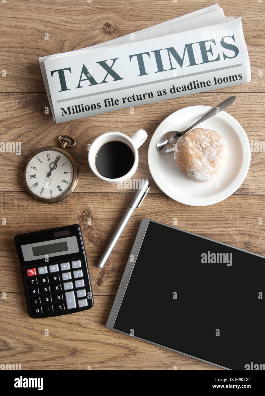 Tax times mock up newspaper with clock, calculator and tablet Stock ...