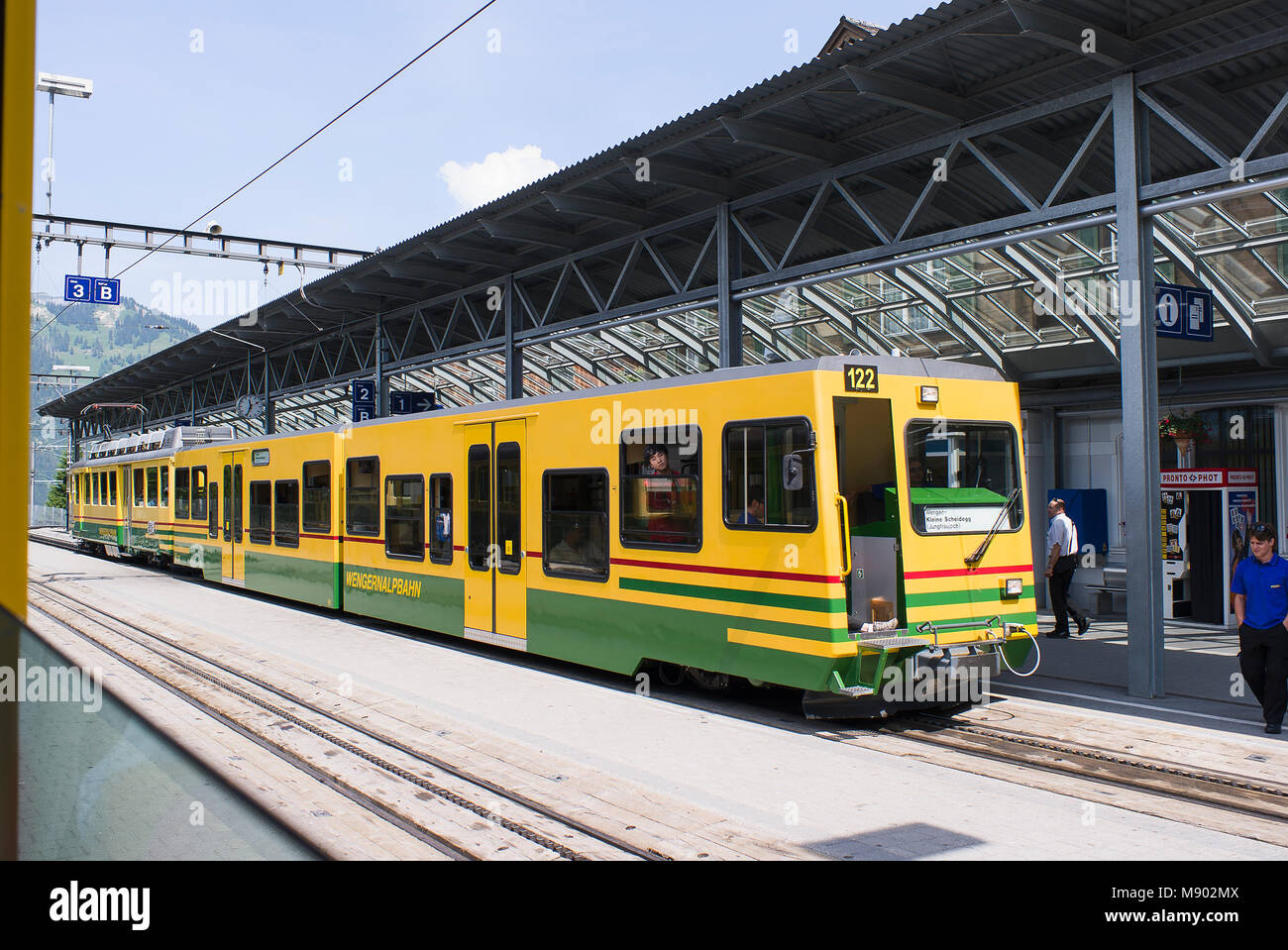 A WENGERNALPBAHN mountain railway train standing in Wengen station in ...