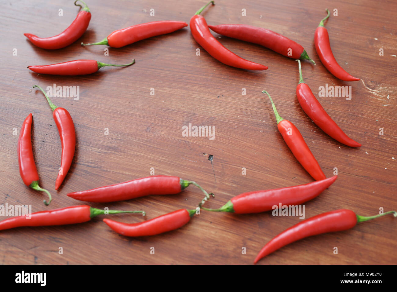 Red chili pepper on the table Stock Photo - Alamy