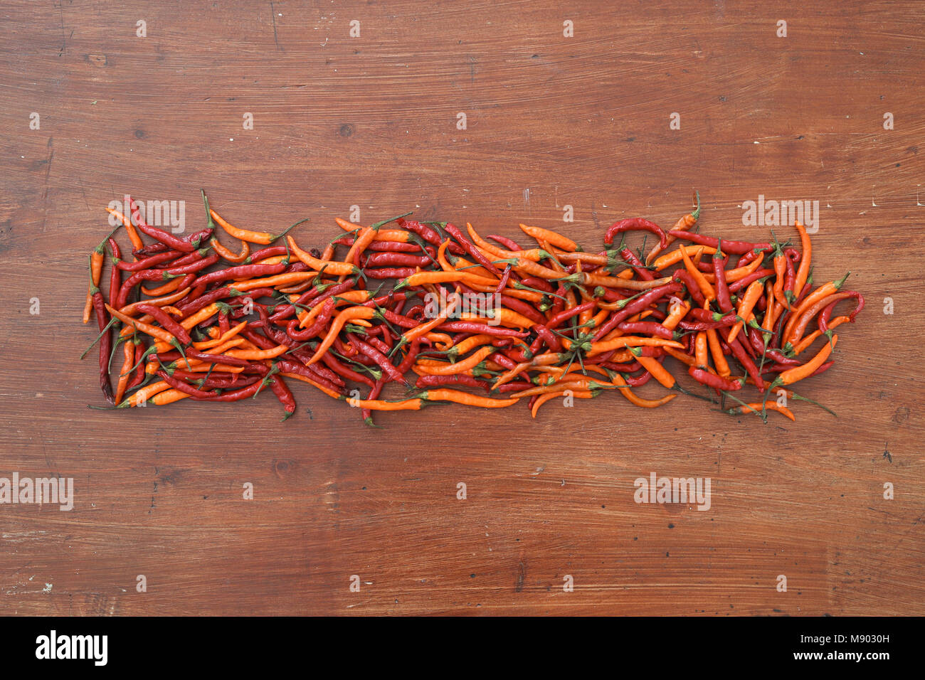 Red chili pepper on the table Stock Photo - Alamy