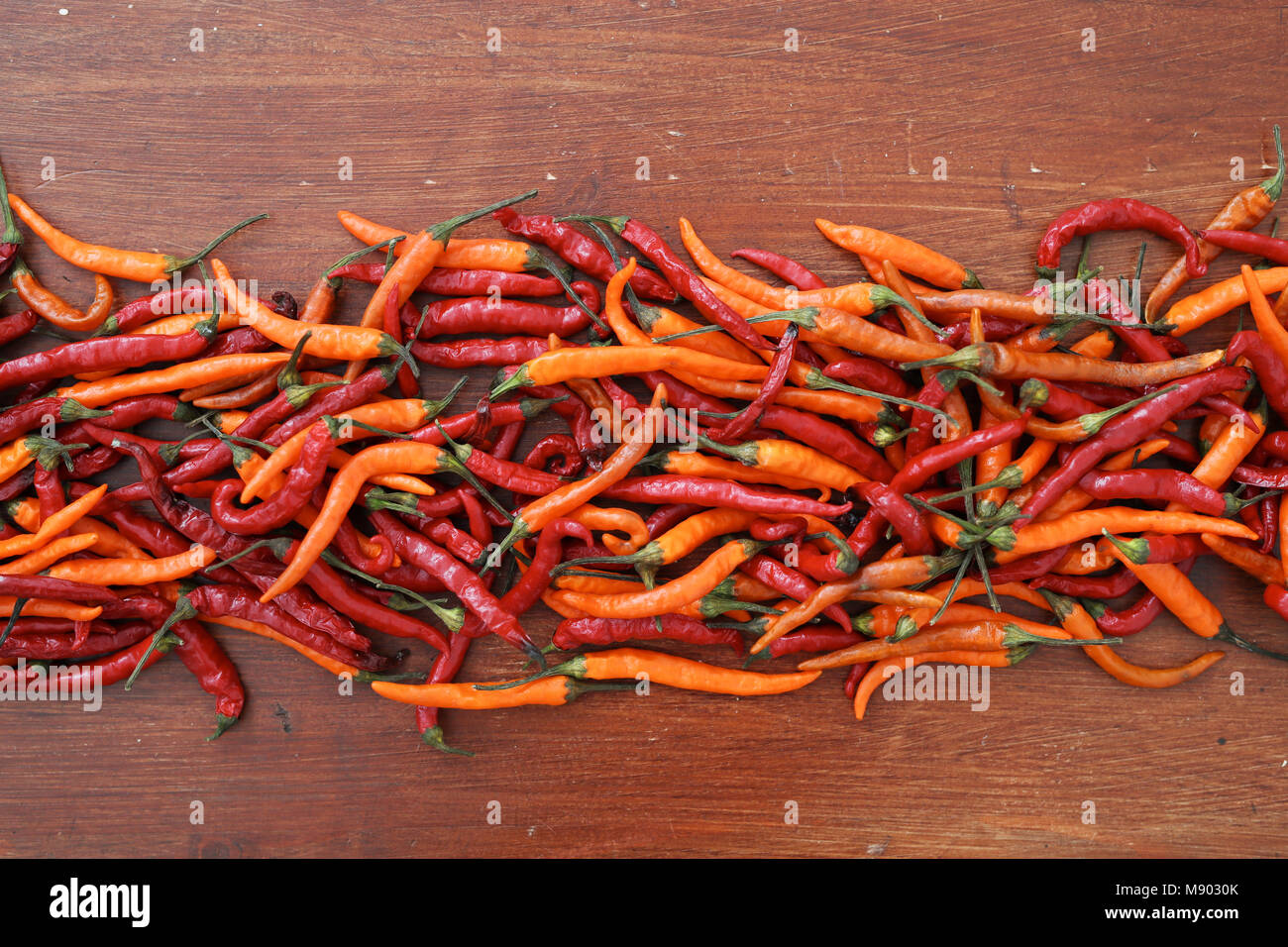 Red chili pepper on the table Stock Photo - Alamy
