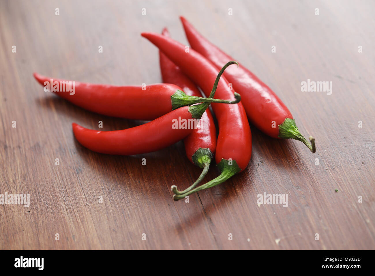 Red chili pepper on the table Stock Photo - Alamy