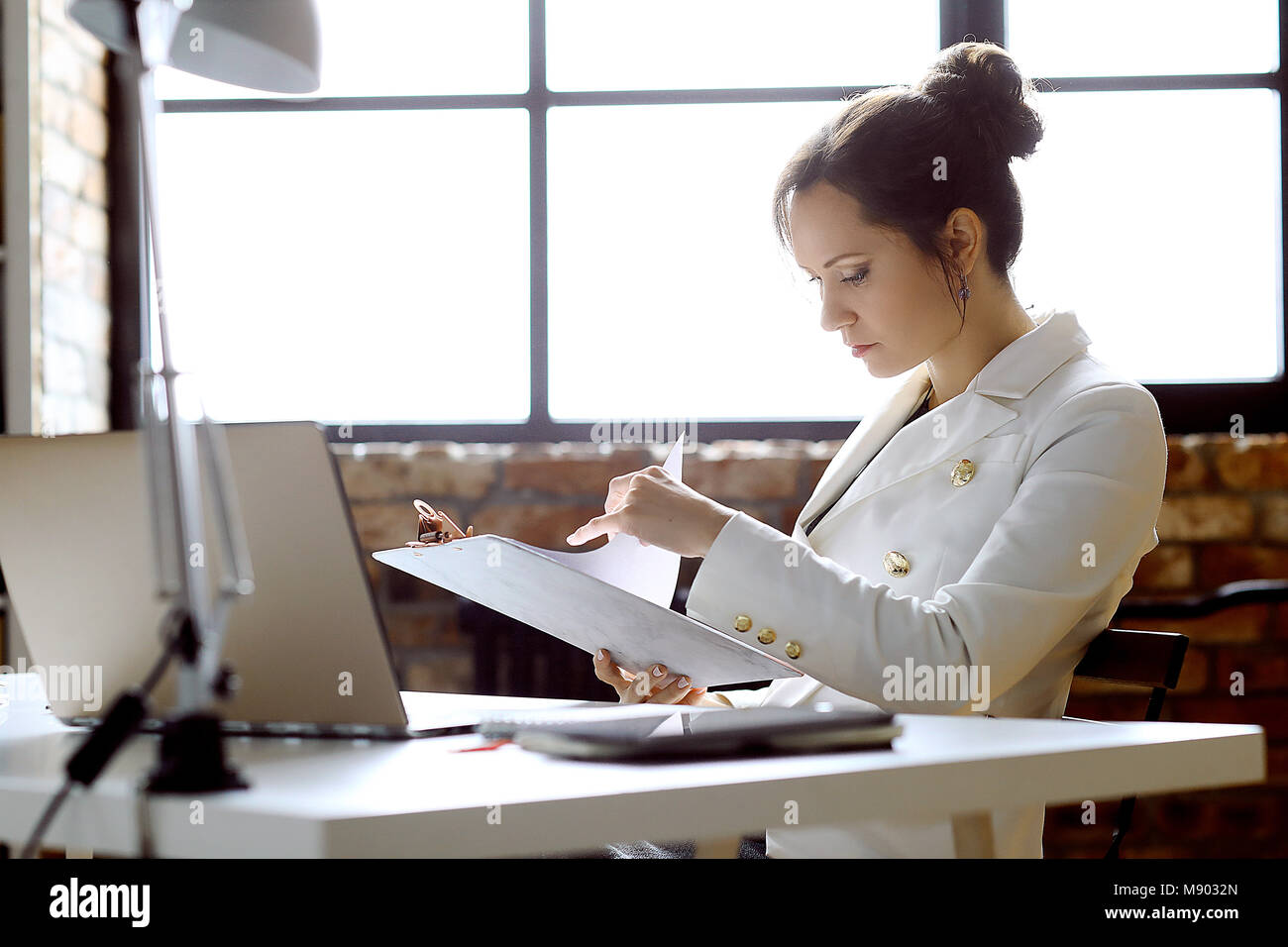 Woman at work in the office Stock Photo - Alamy