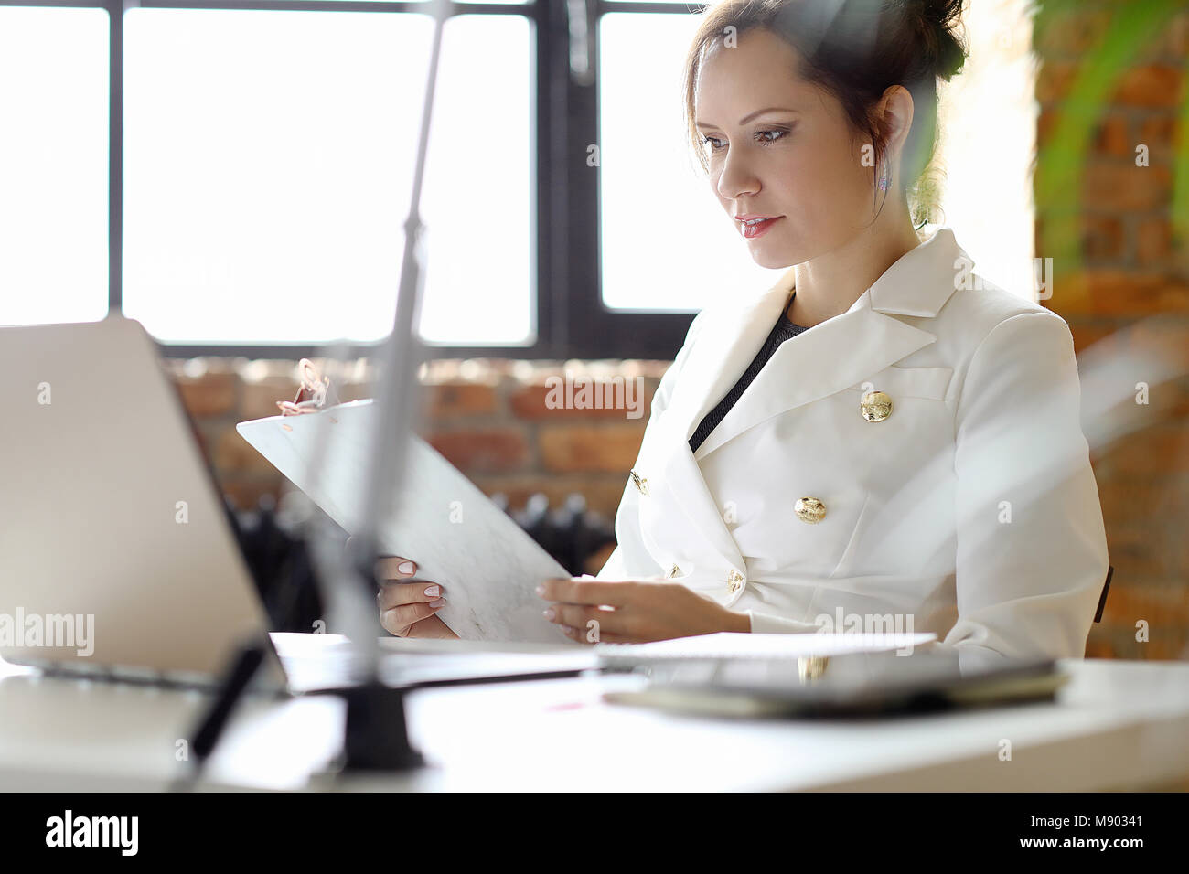 Woman at work in the office Stock Photo - Alamy