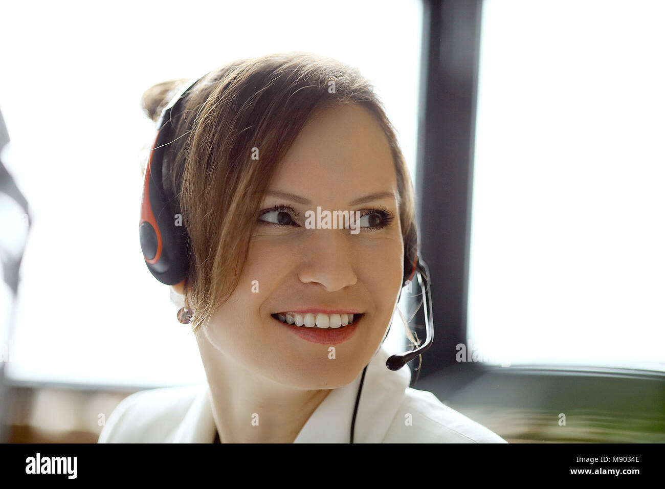 Woman working in call center as dispatcher Stock Photo - Alamy