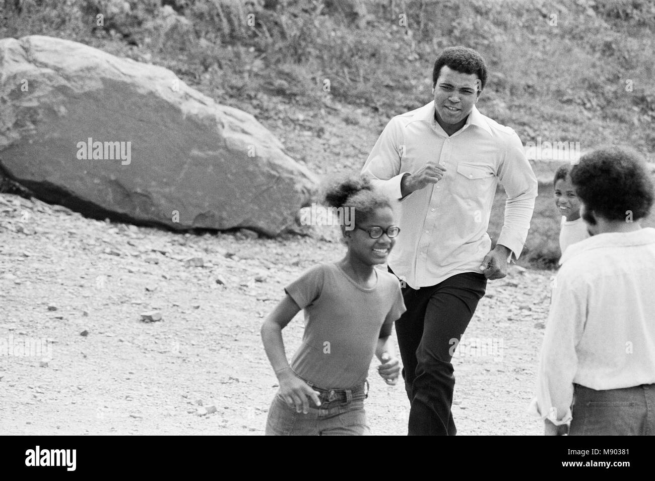 Muhammad Ali chasing a little girl at his training camp in Pennsylvania ...