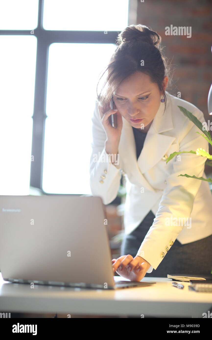Woman at work in the office Stock Photo - Alamy