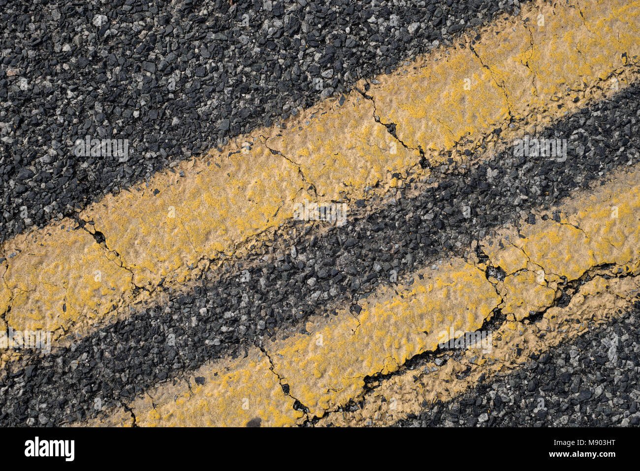 double yellow street lines on old country asphalt road. Close up Stock ...