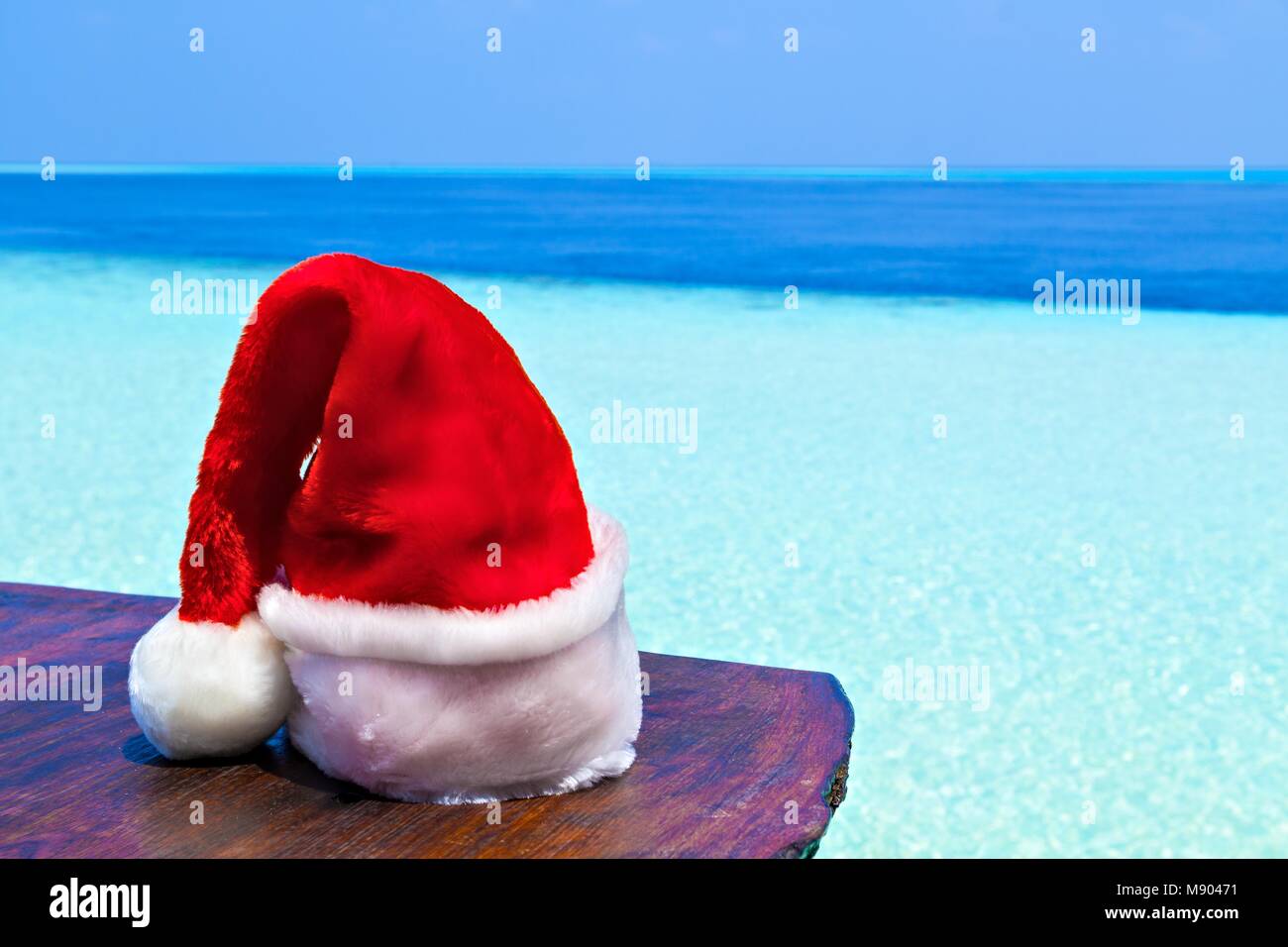 Santa hat is on a beach table, Maldives, The Indian Ocean Stock Photo ...