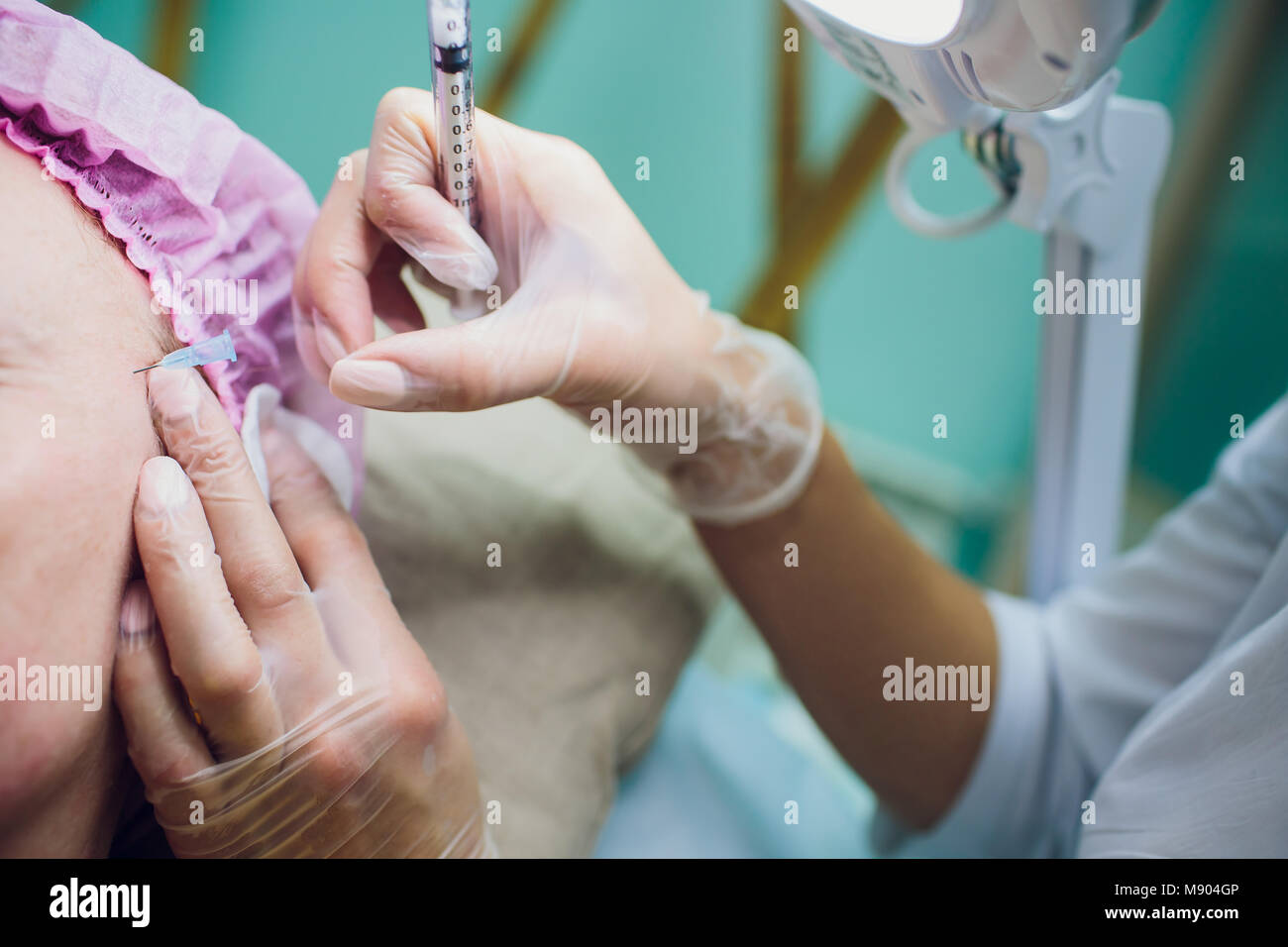 Professional holding the needle cannula on hand. Closeup. Female Stock ...