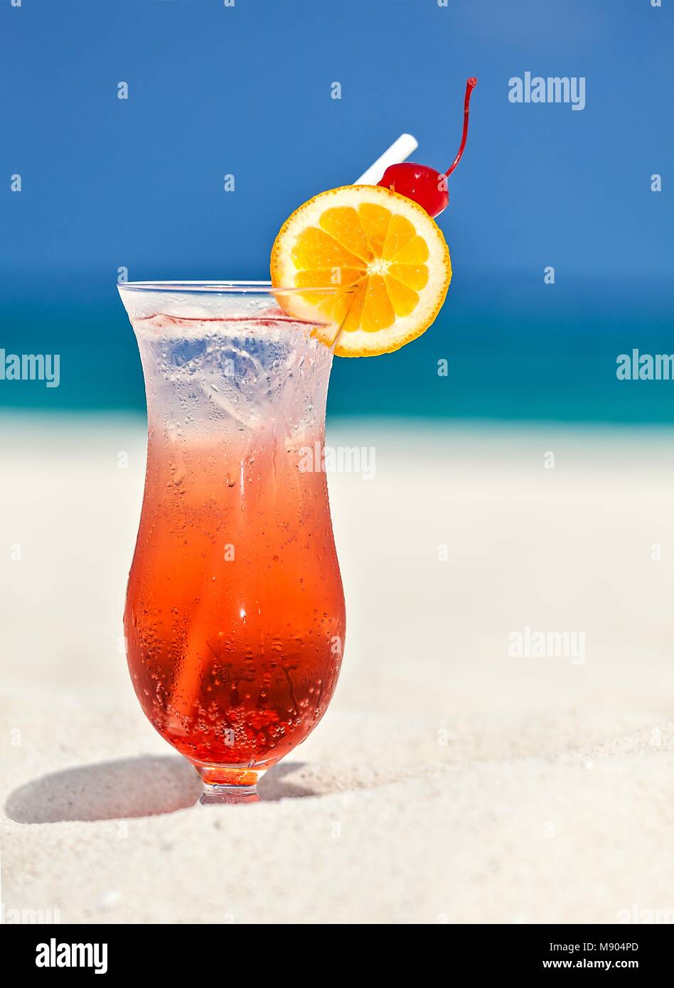 Glass of cocktail is on sandy coral beach, Maldives, The Indian Ocean ...