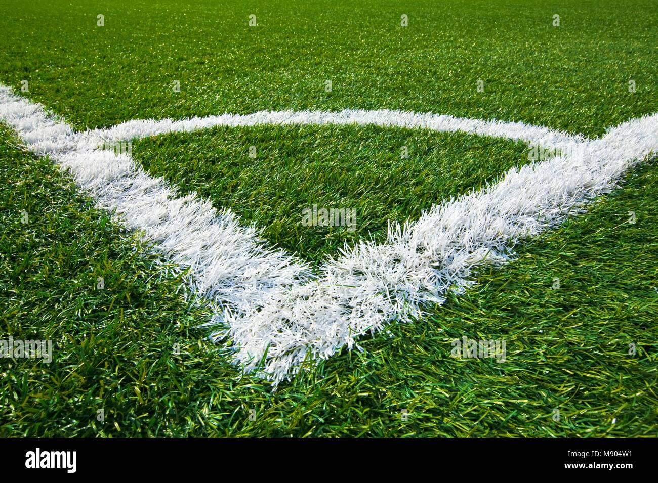 Corner of a football (soccer) field is made from synthetic lawn Stock ...