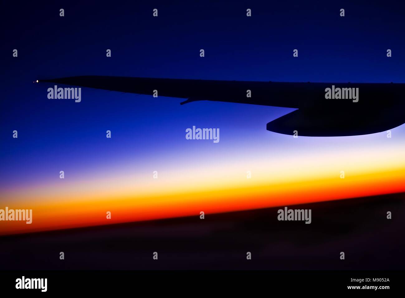 Nice sunrise view from airplane Stock Photo - Alamy
