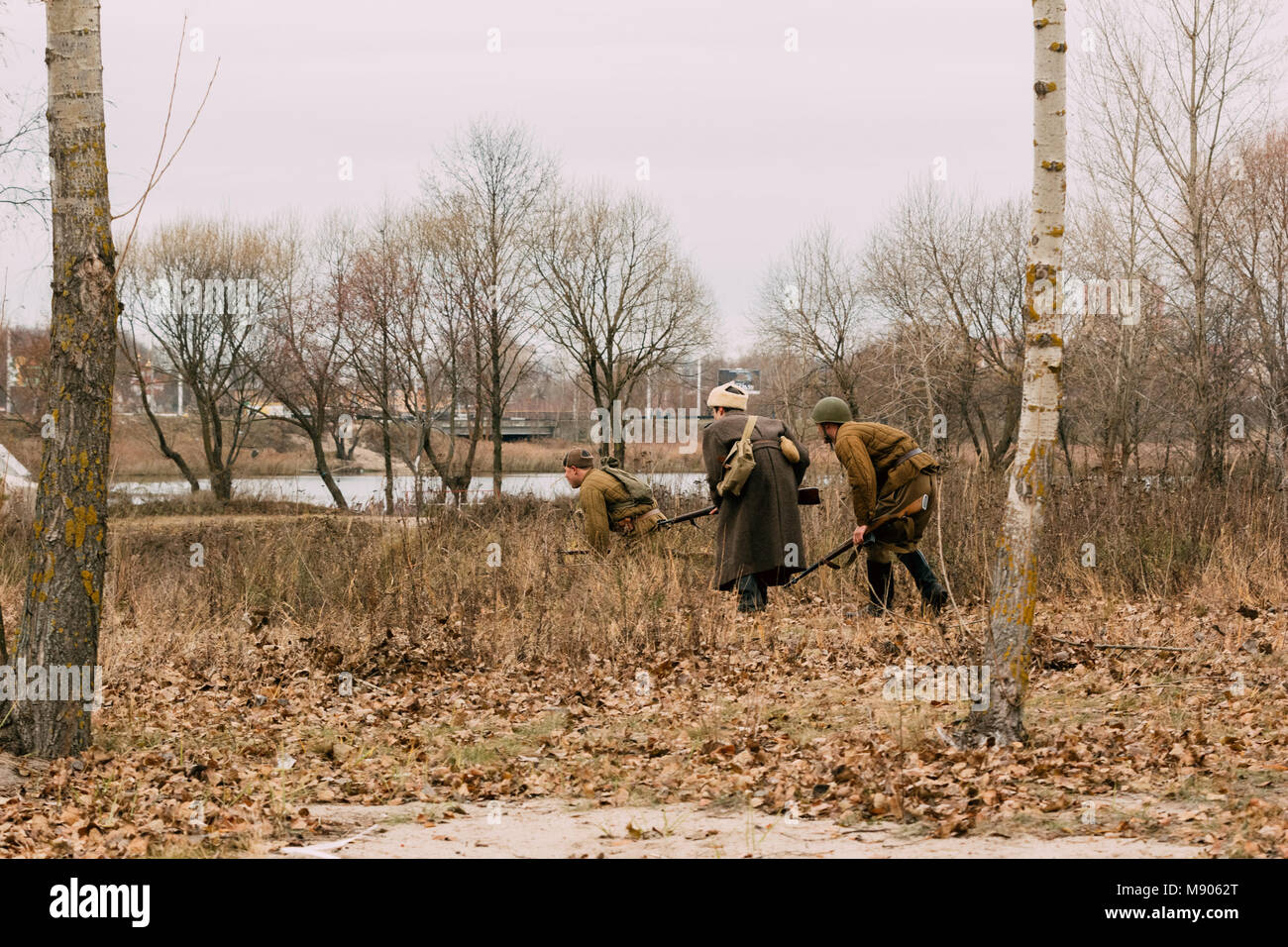 Scouts of Red Army men make their way through the autumn field to the ...