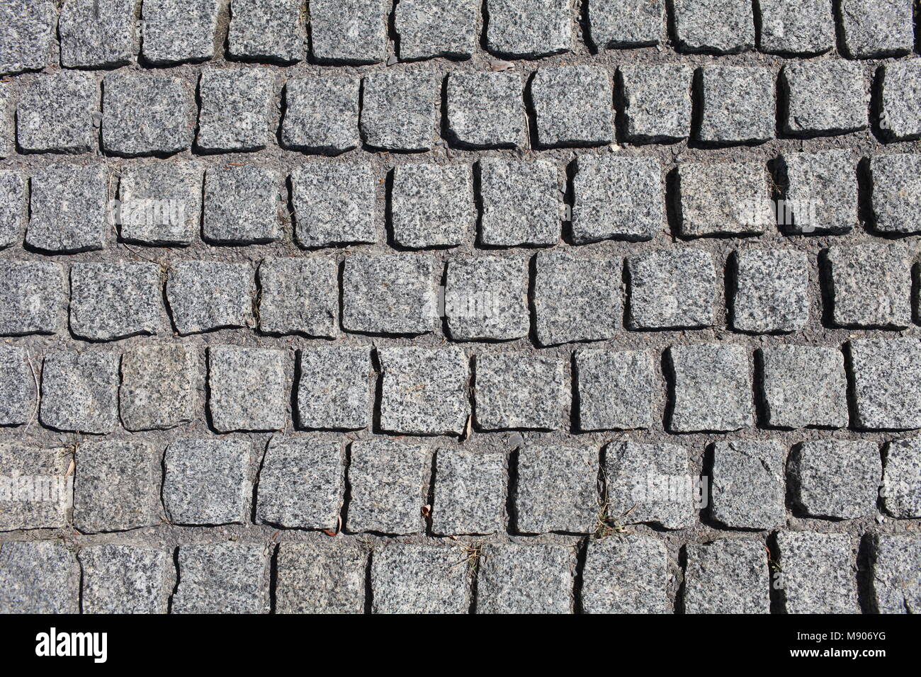 granite gray cobblestone pavement abstract background Stock Photo - Alamy