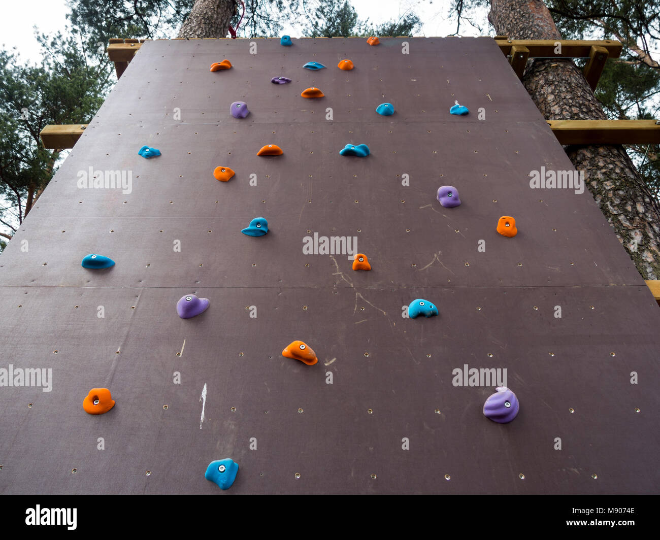 Wall climbing wall for training climbers in the park Stock Photo - Alamy